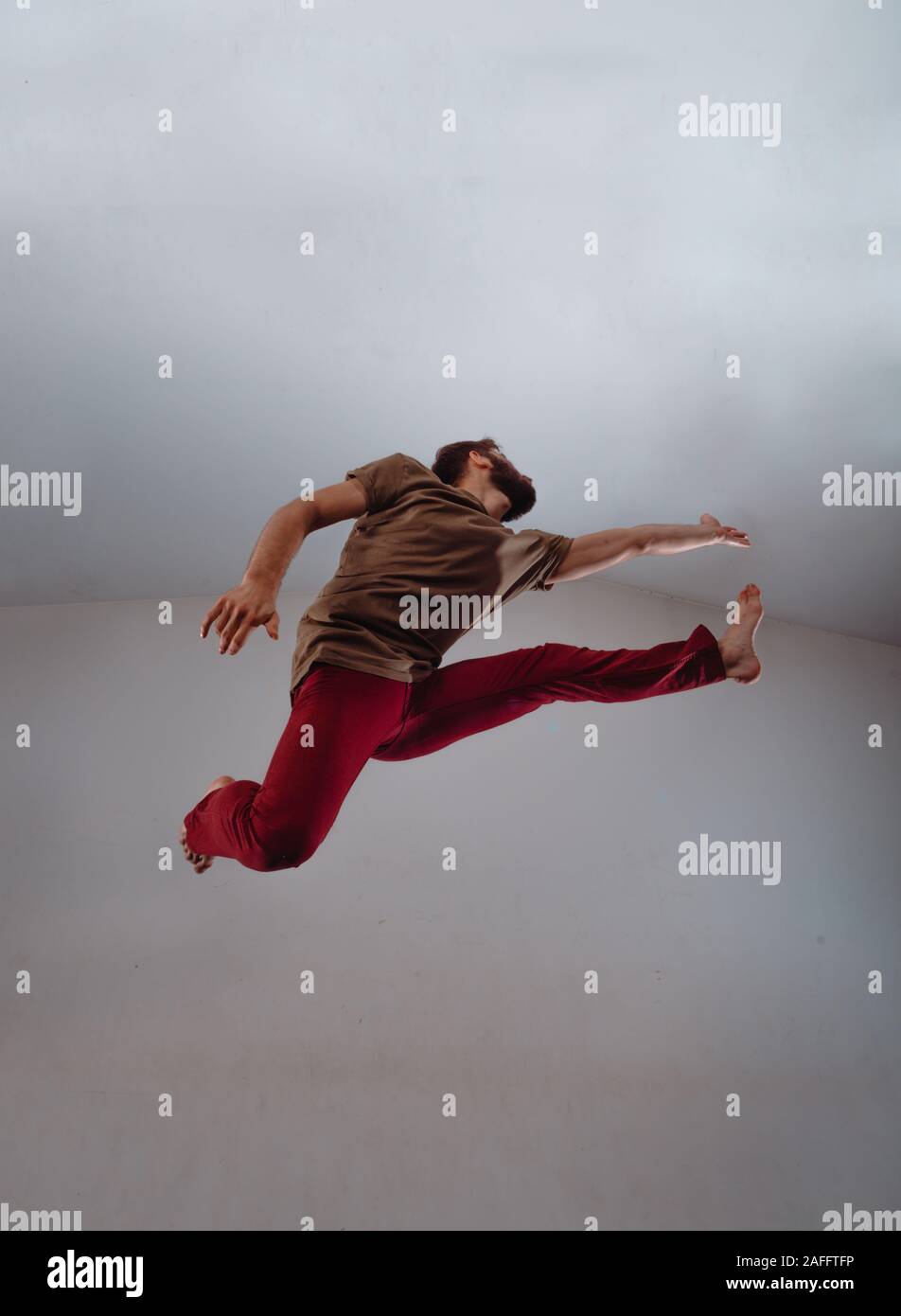 Dance moves performed by an acrobatic flexible male dancer Stock Photo ...