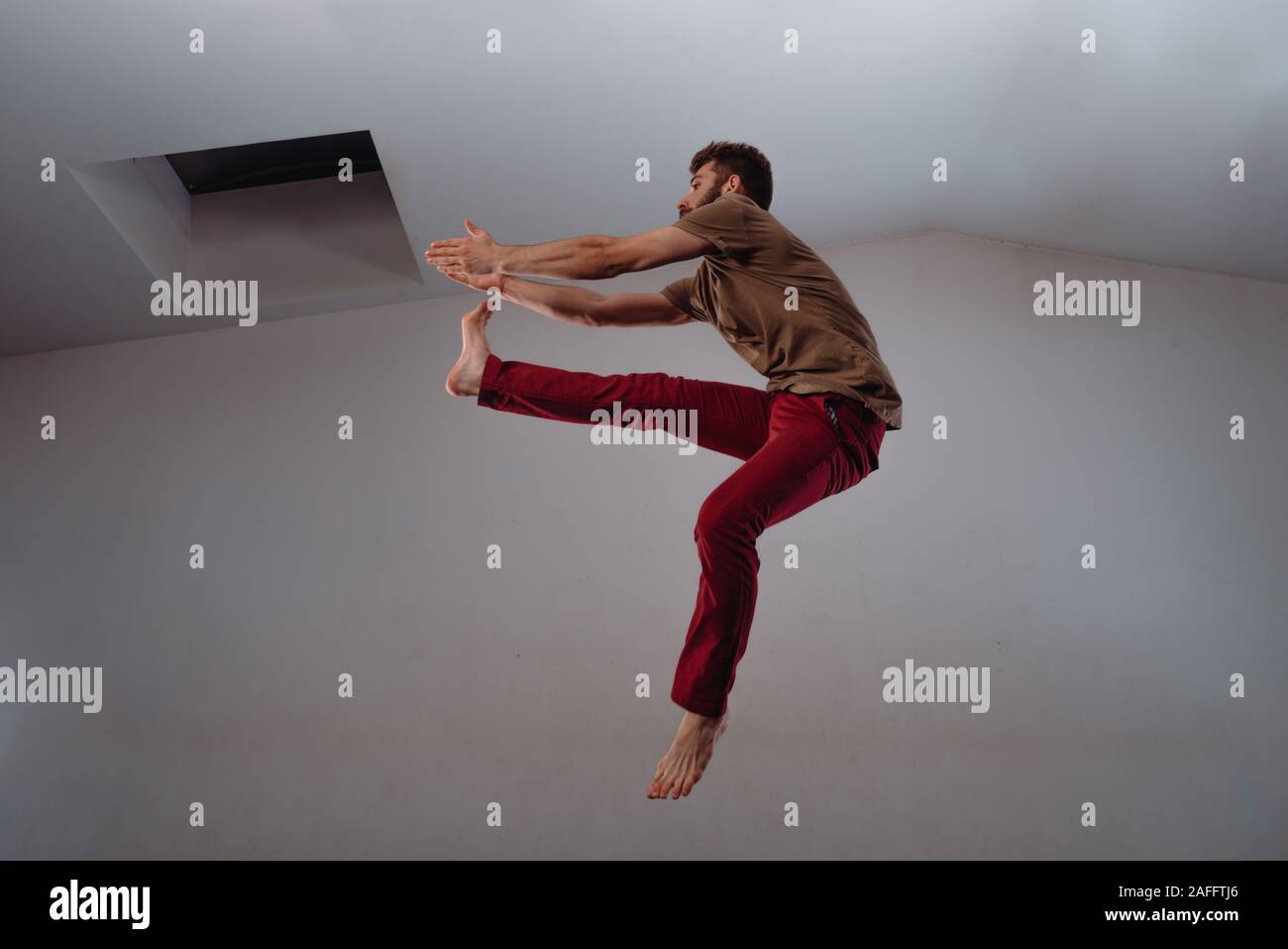 Artistic modern dancer practicing dancing moves in the studio Stock ...