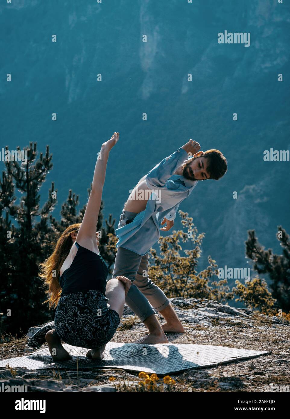 Romantic couple dancing and smiling outside at the mountain peak Stock ...