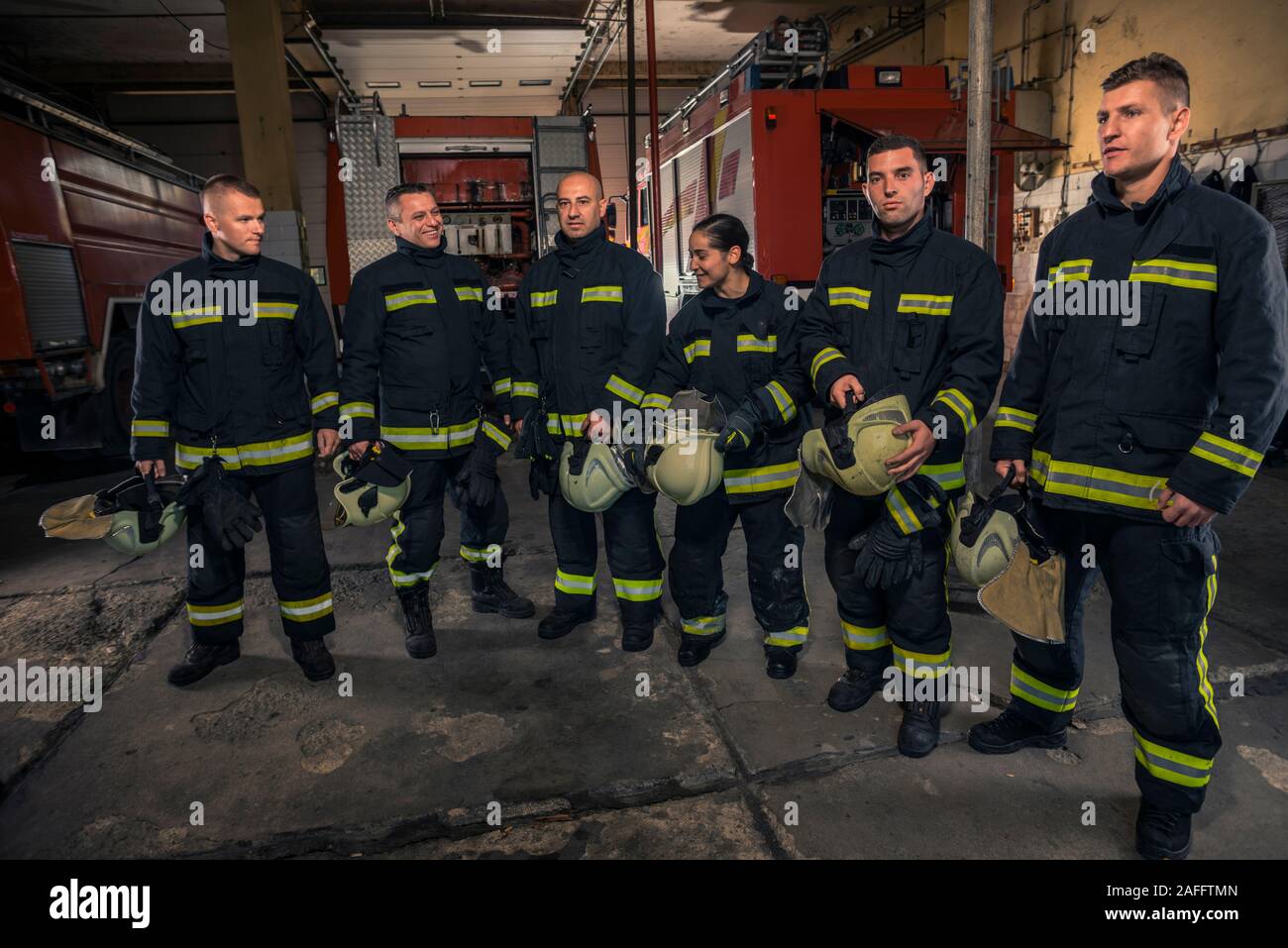 Firewoman standing fire engine hi-res stock photography and images - Alamy