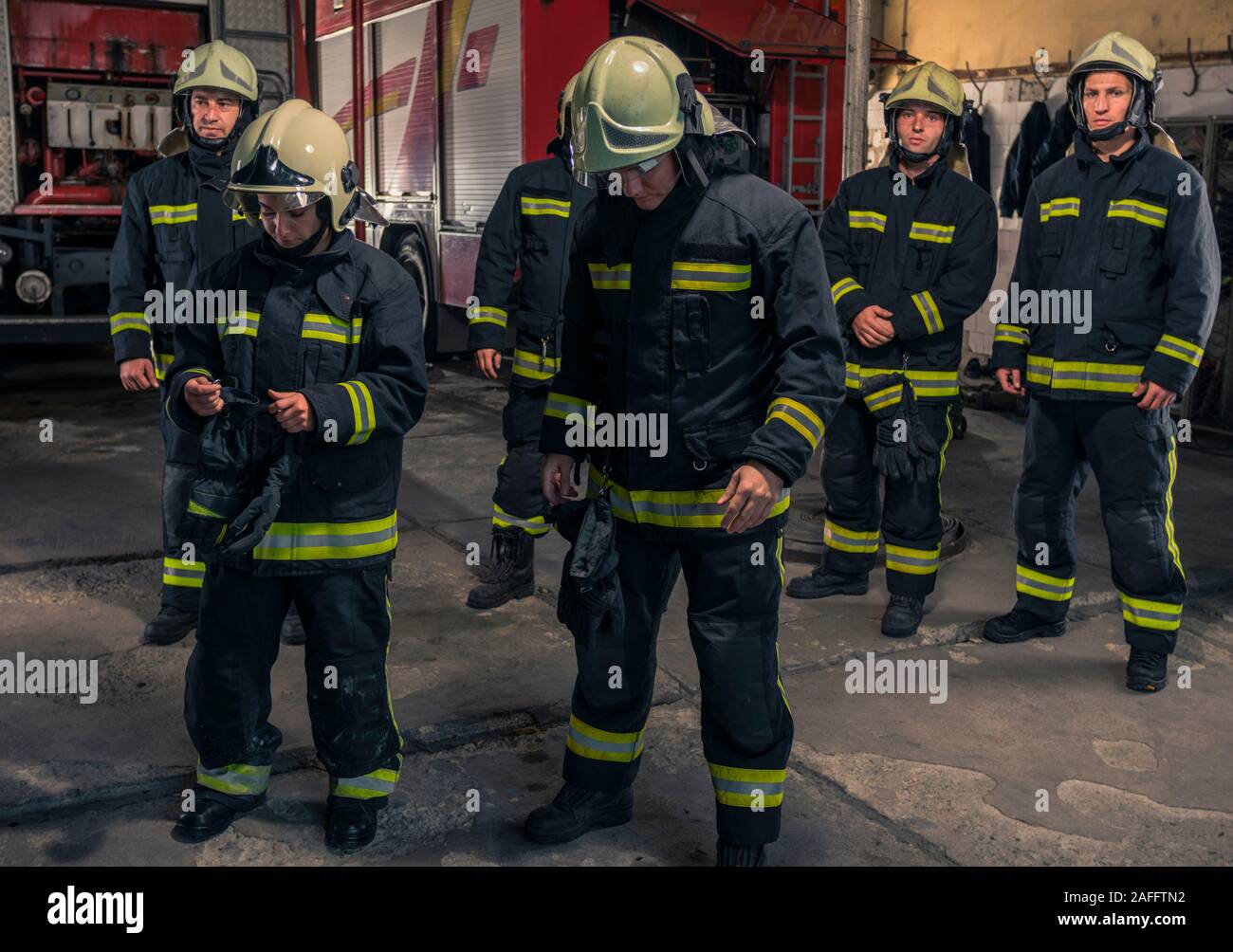 Group of firefighters standing confident with arms crossed. Firemen ...