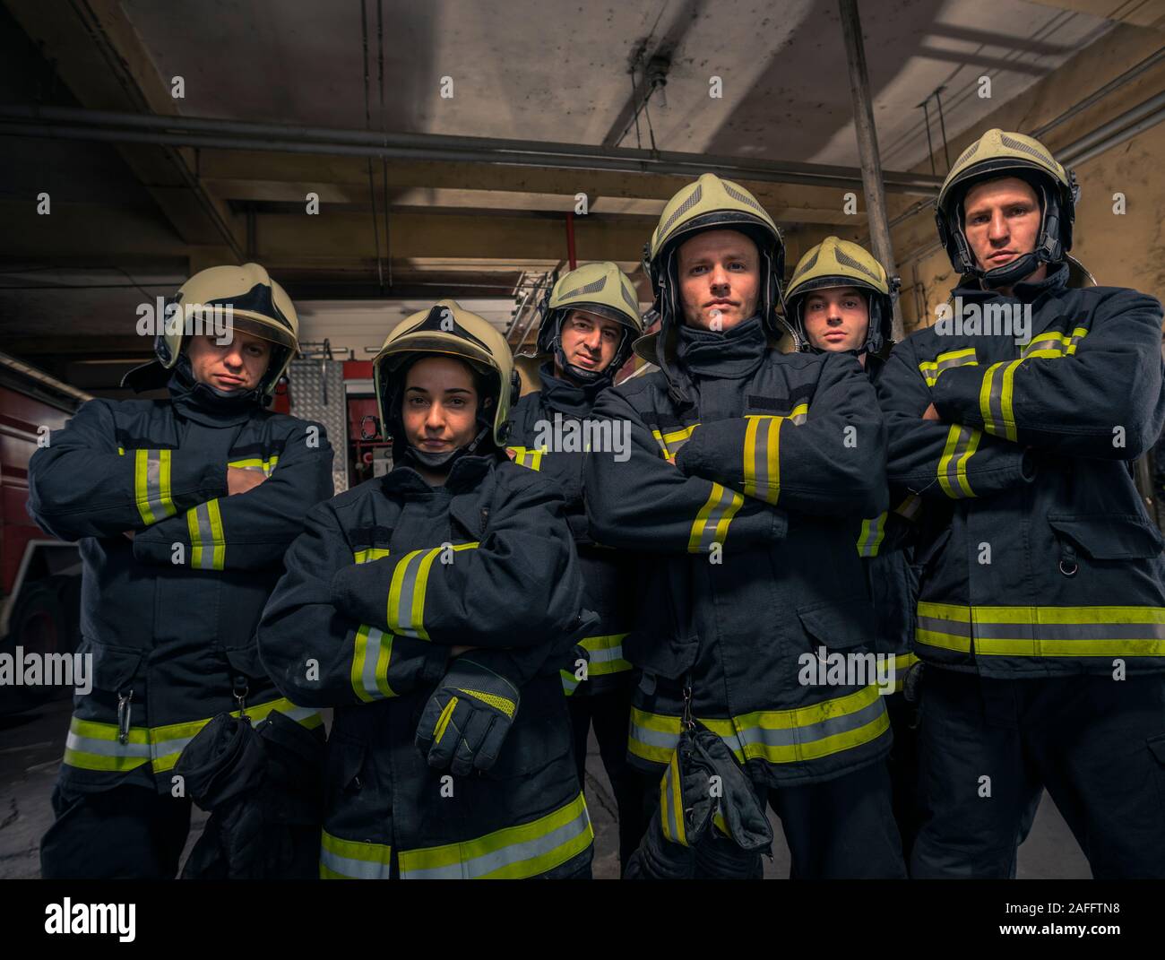 Group of firefighters standing confident with arms crossed. Firemen ...