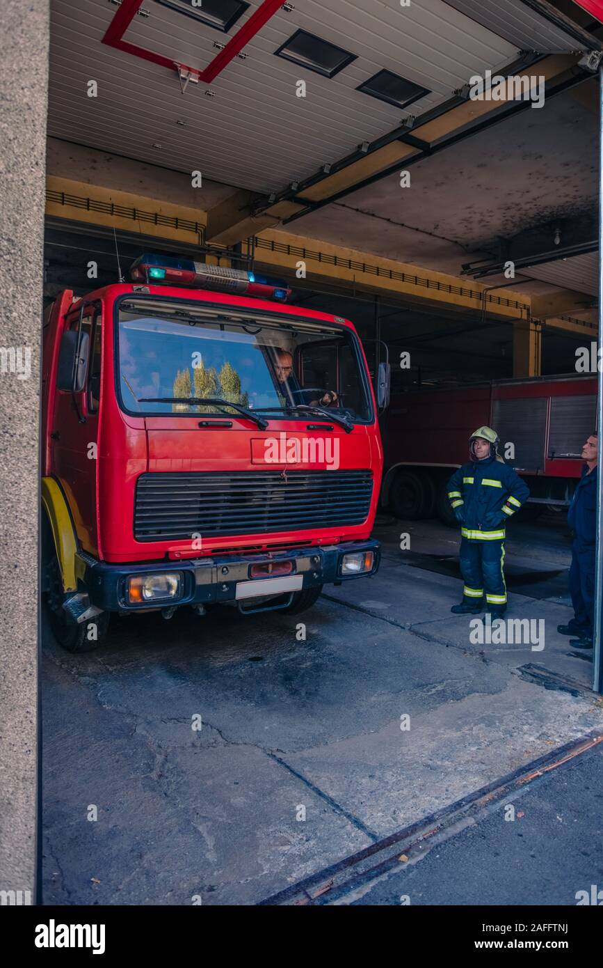 Fire engine inside the garage of the fire department Stock Photo - Alamy