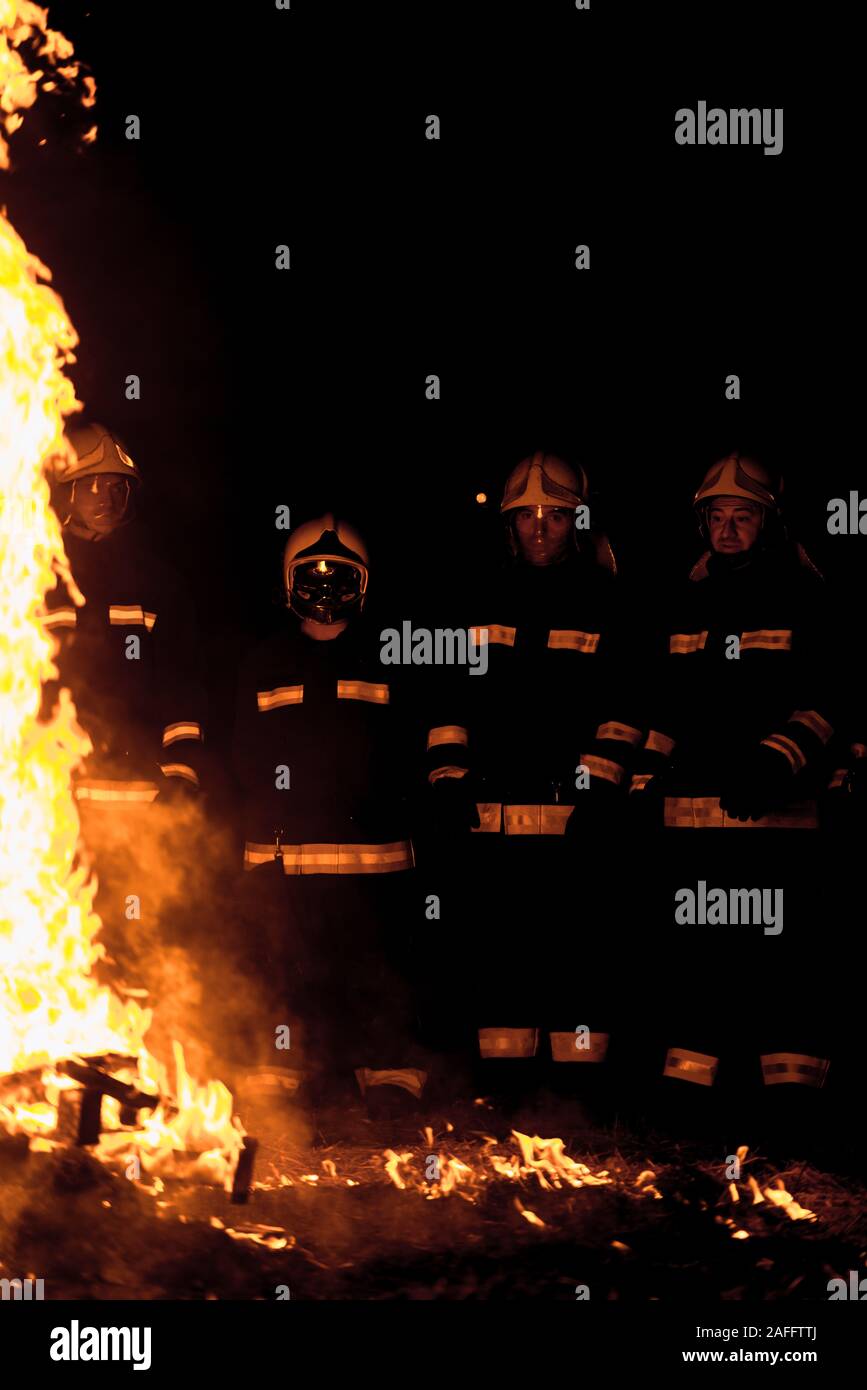 Firemen getting ready during a firefighting intervention Stock Photo ...