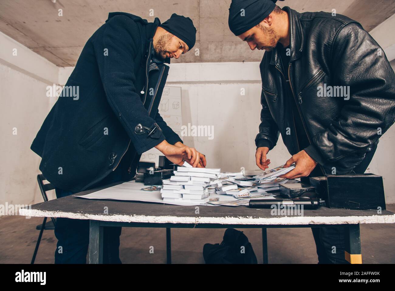 Gangsters are counting money in a dark room Stock Photo - Alamy