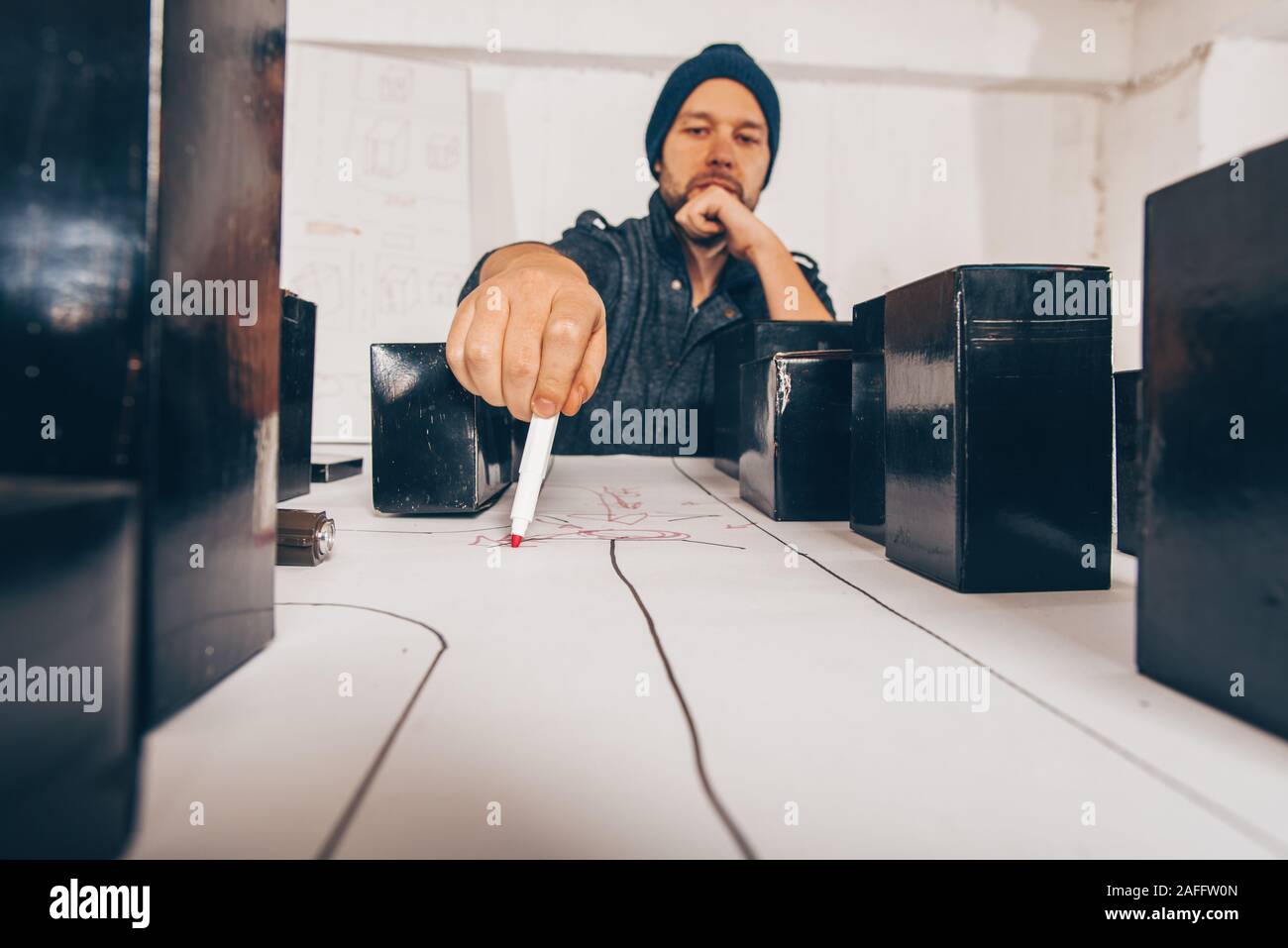 Thief sitting and making a plan for heist Stock Photo - Alamy
