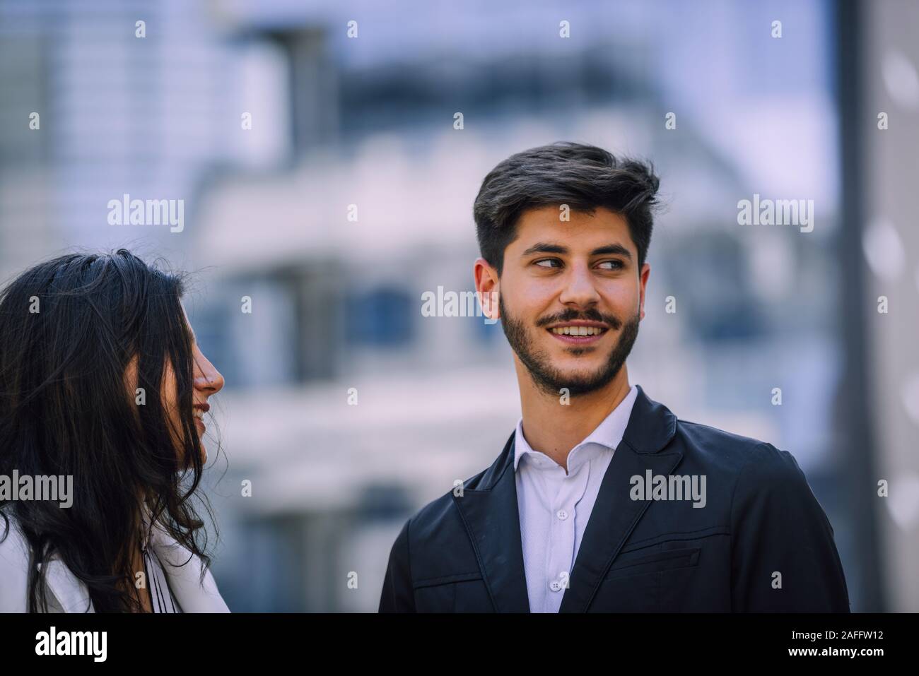 Female executive with office building behind hi-res stock photography ...