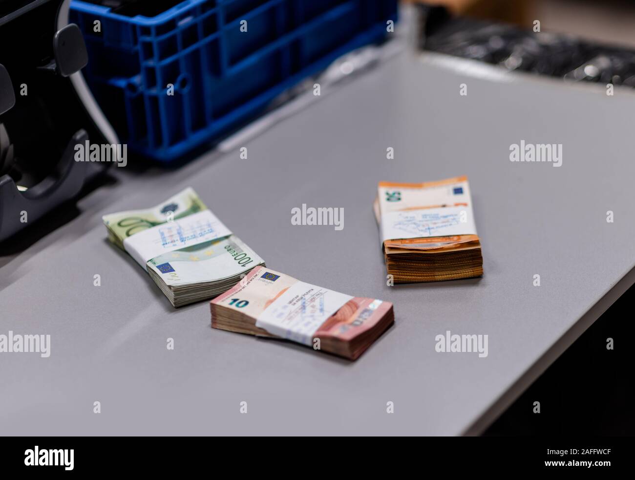 Bundles of various types of euro € bills with currency straps placed on ...