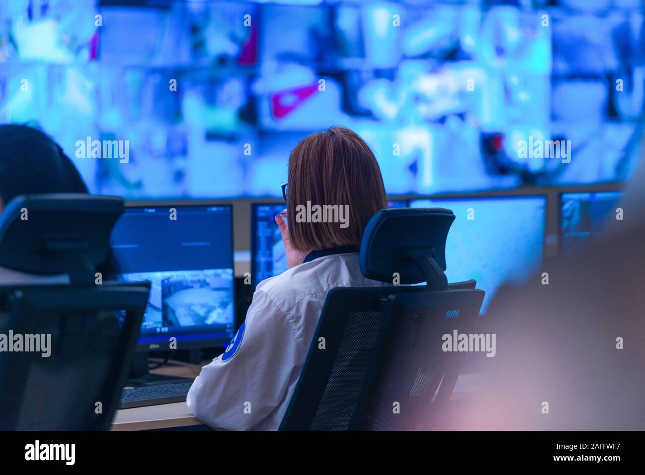 In the System Control Room, Technical Operator Works at His Workstation ...