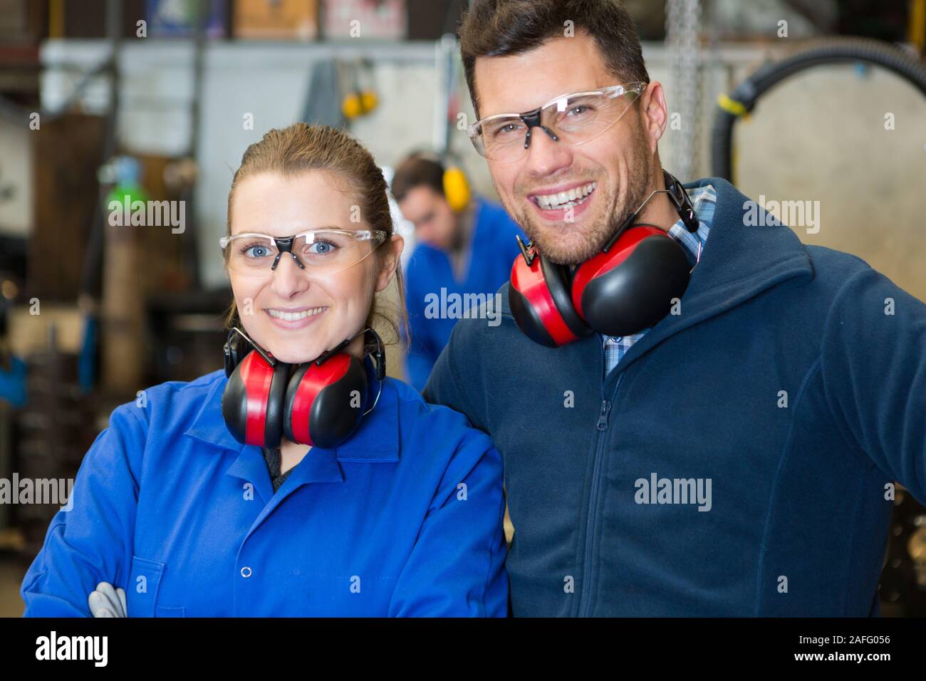 Portrait friendly smiling factory workers hi-res stock photography and ...