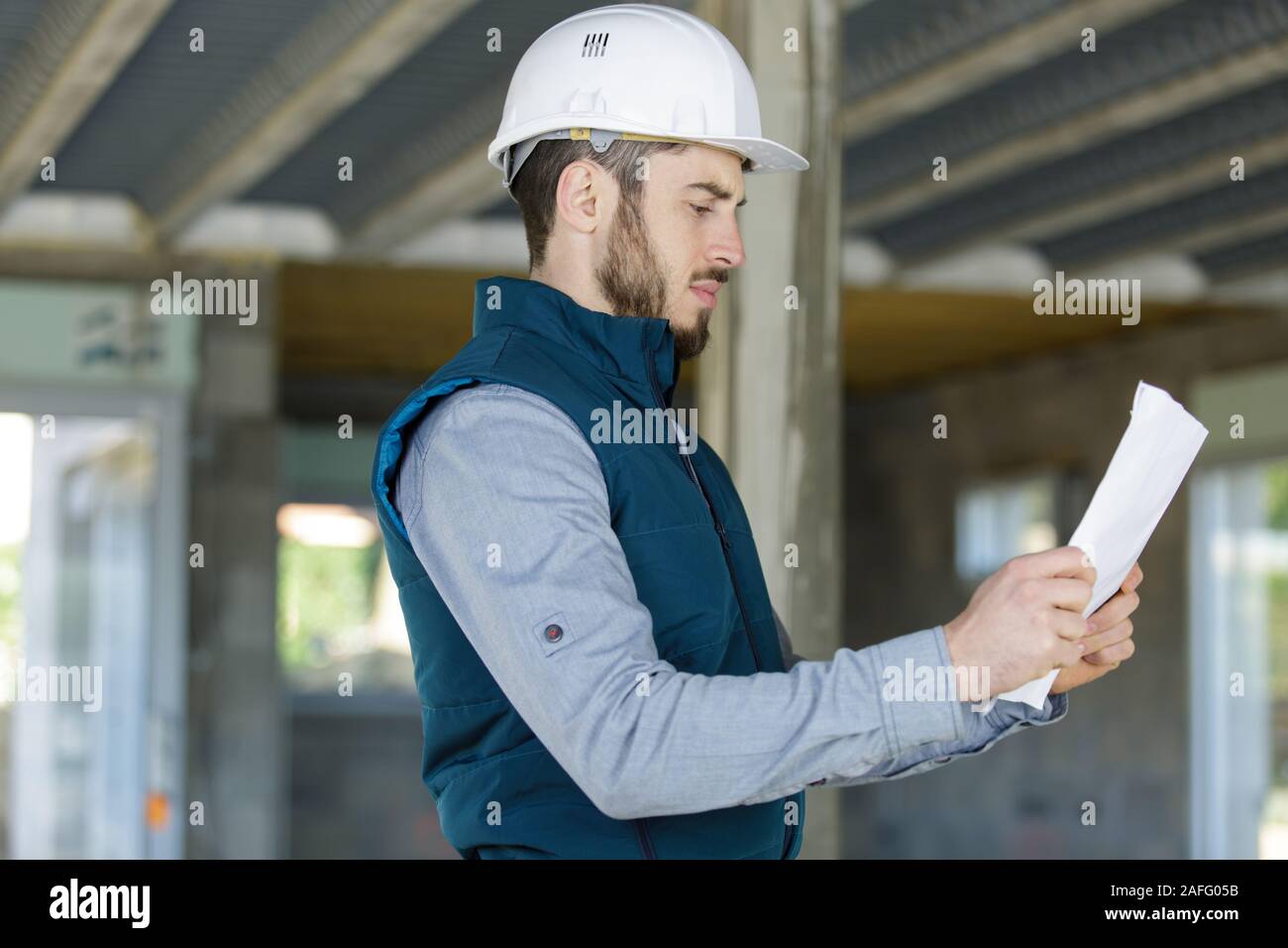 portrait of construction worker on building site Stock Photo - Alamy