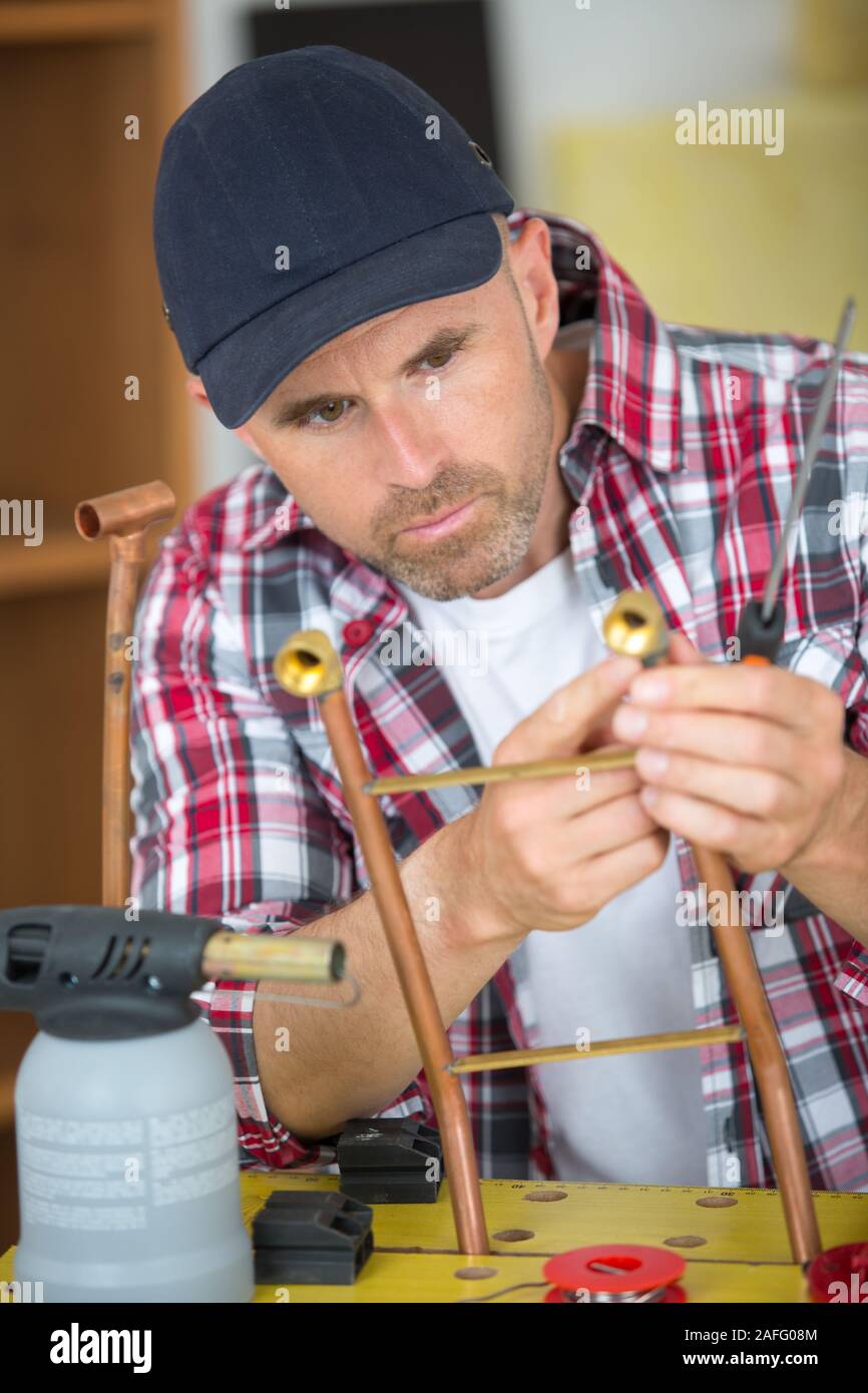 plumber using welding gas torch to solder copper pipes Stock Photo - Alamy