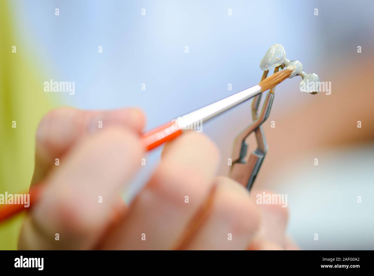 dental engineer with a brush Stock Photo - Alamy