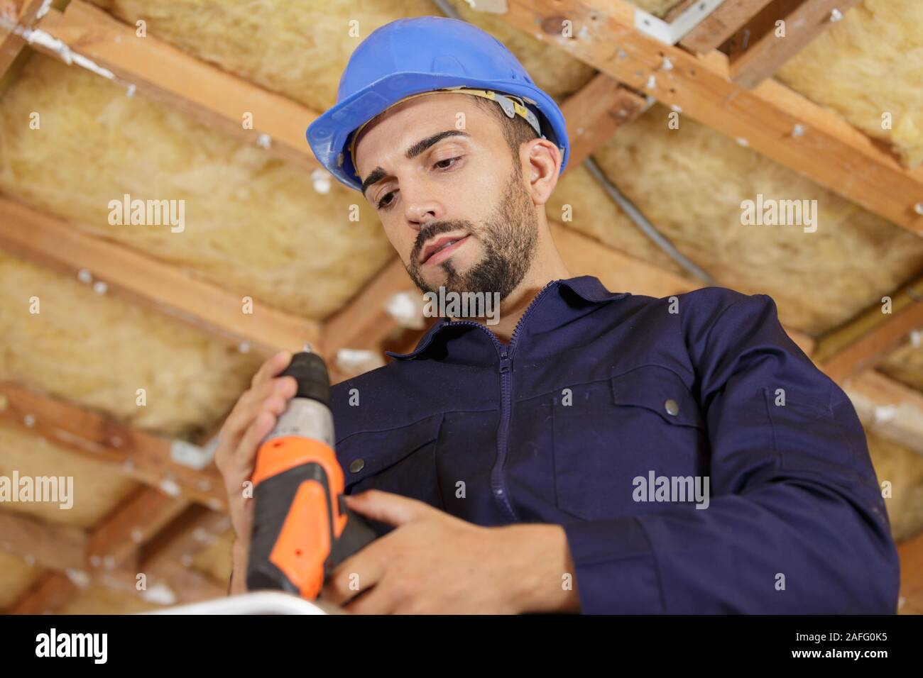 construction worker using an electrical drill Stock Photo - Alamy