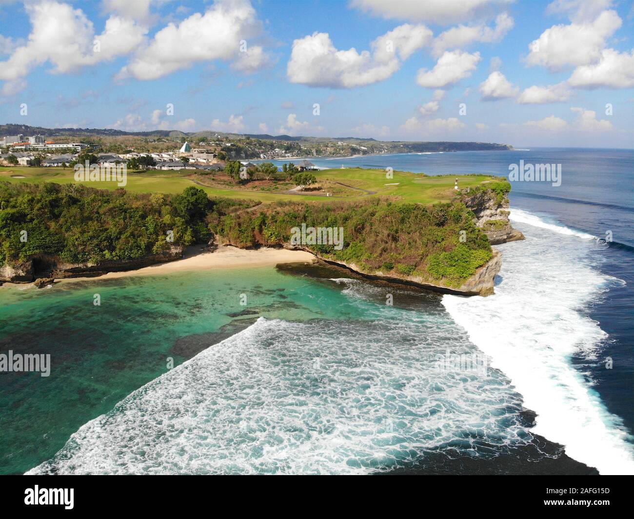 Aerial view of an amazing little beach with rock cliff in Bali ...