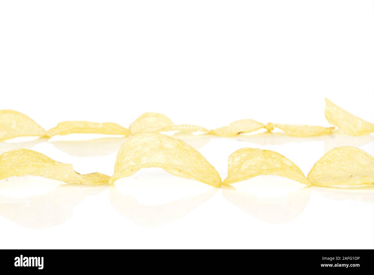 Lot of whole crisp potato chip two lines isolated on white background ...