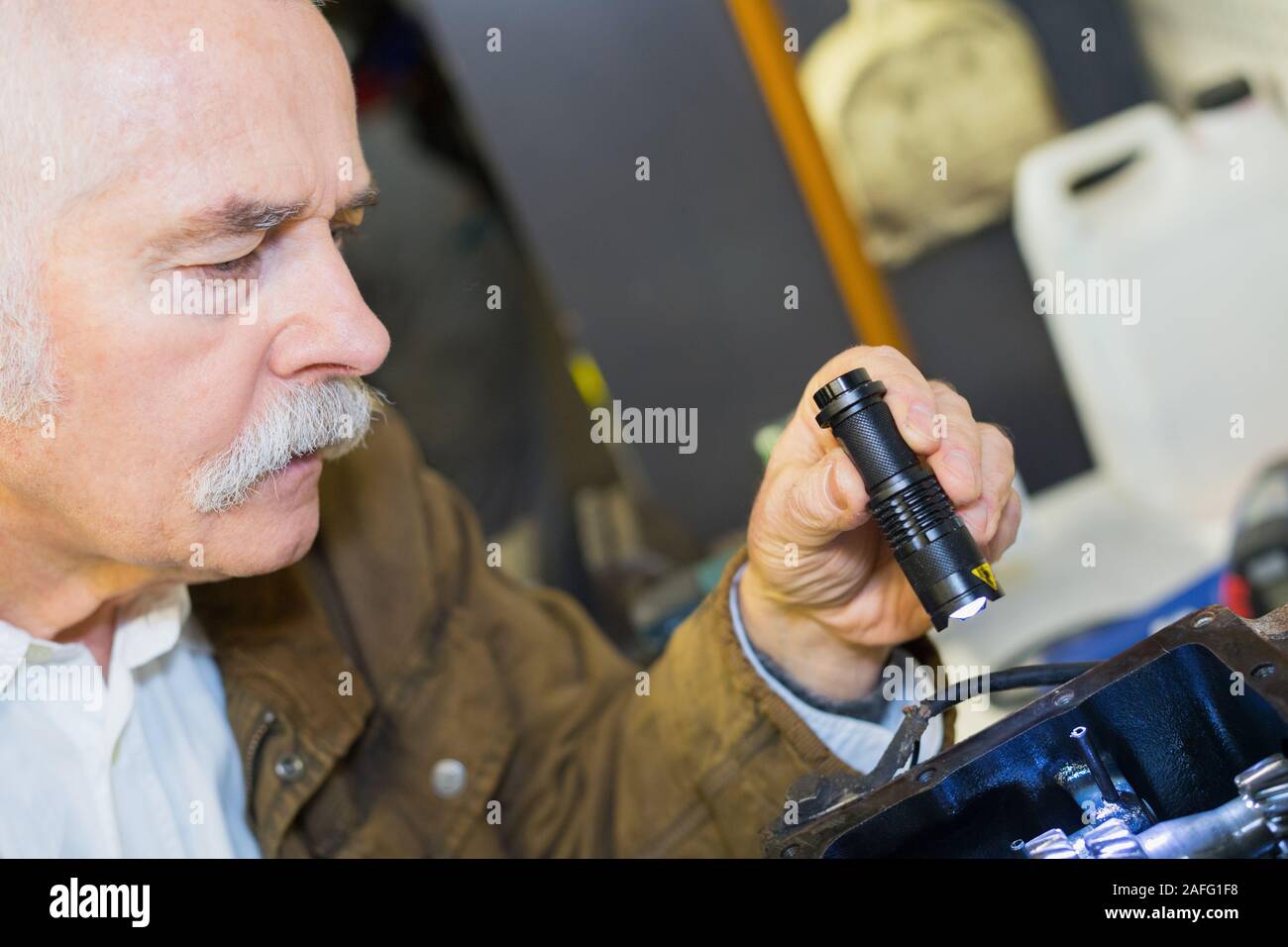 senior checking something Stock Photo - Alamy