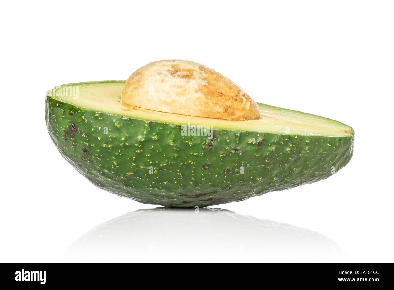 One half of fresh green avocado isolated on white background Stock ...