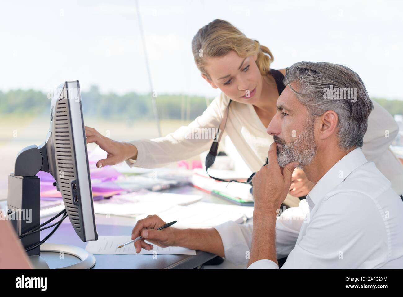 business man and woman with computer Stock Photo - Alamy