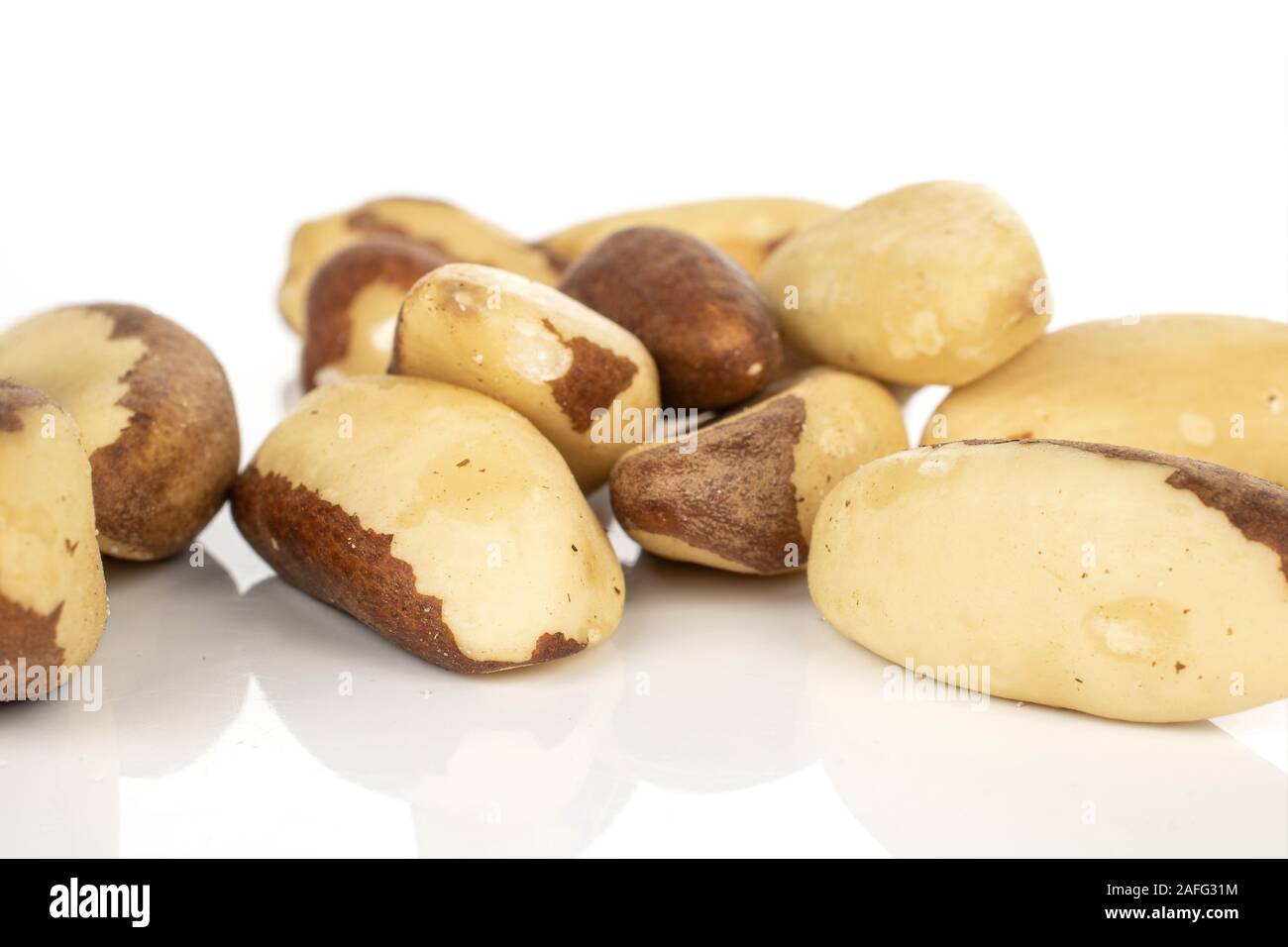 Lot of whole brazil brown nut stack isolated on white background Stock ...