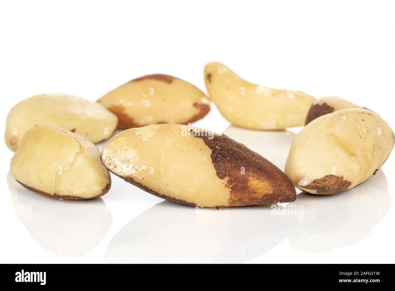 Group of seven whole brazil brown nut isolated on white background ...