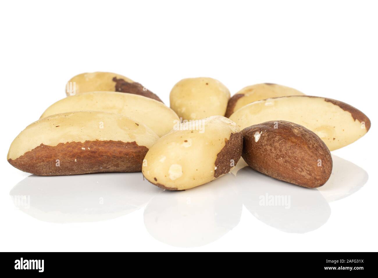 Group of eight whole brazil brown nut isolated on white background ...