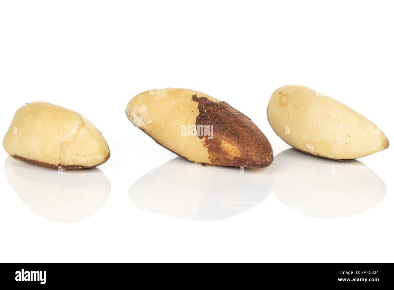 Group of three whole brazil brown nut isolated on white background ...