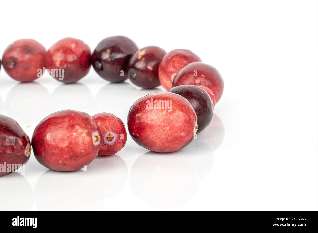 Lot of whole fresh red cranberry ring isolated on white background ...