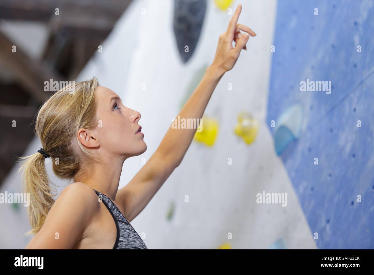 young climber pointing at wall Stock Photo - Alamy