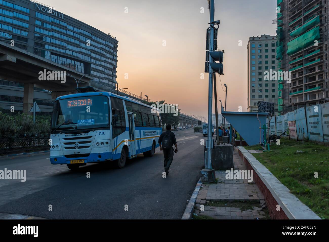 People getting on bus at shelter stop in New Town, Kolkata, India on ...