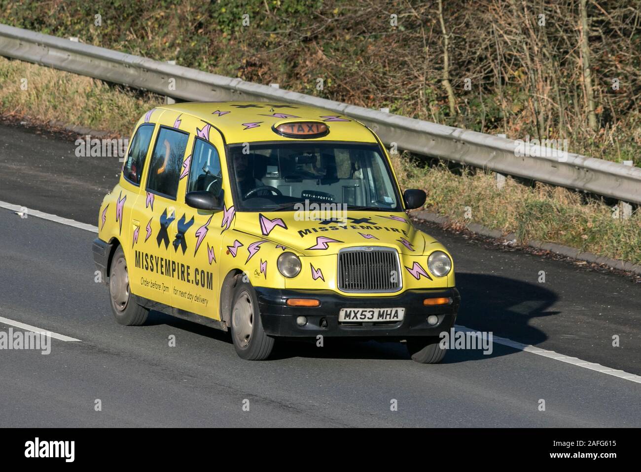 Missy Empire yellow London Taxis Int Txii Bronze Autoi driving on the ...