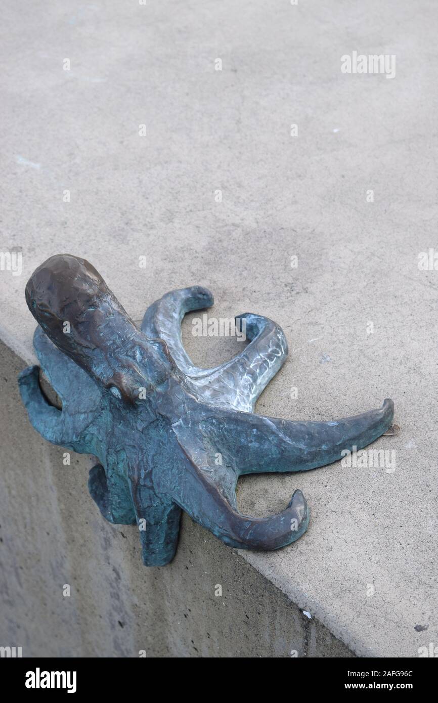 Bronze octopus sculpture hugging a concrete bench on the Embarcadero ...