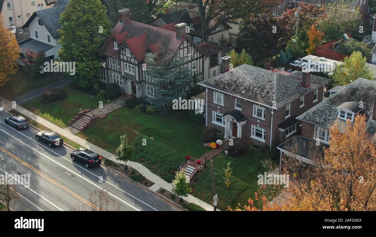 Colorful autumn foliage in suburban area, vintage villas and mansions ...