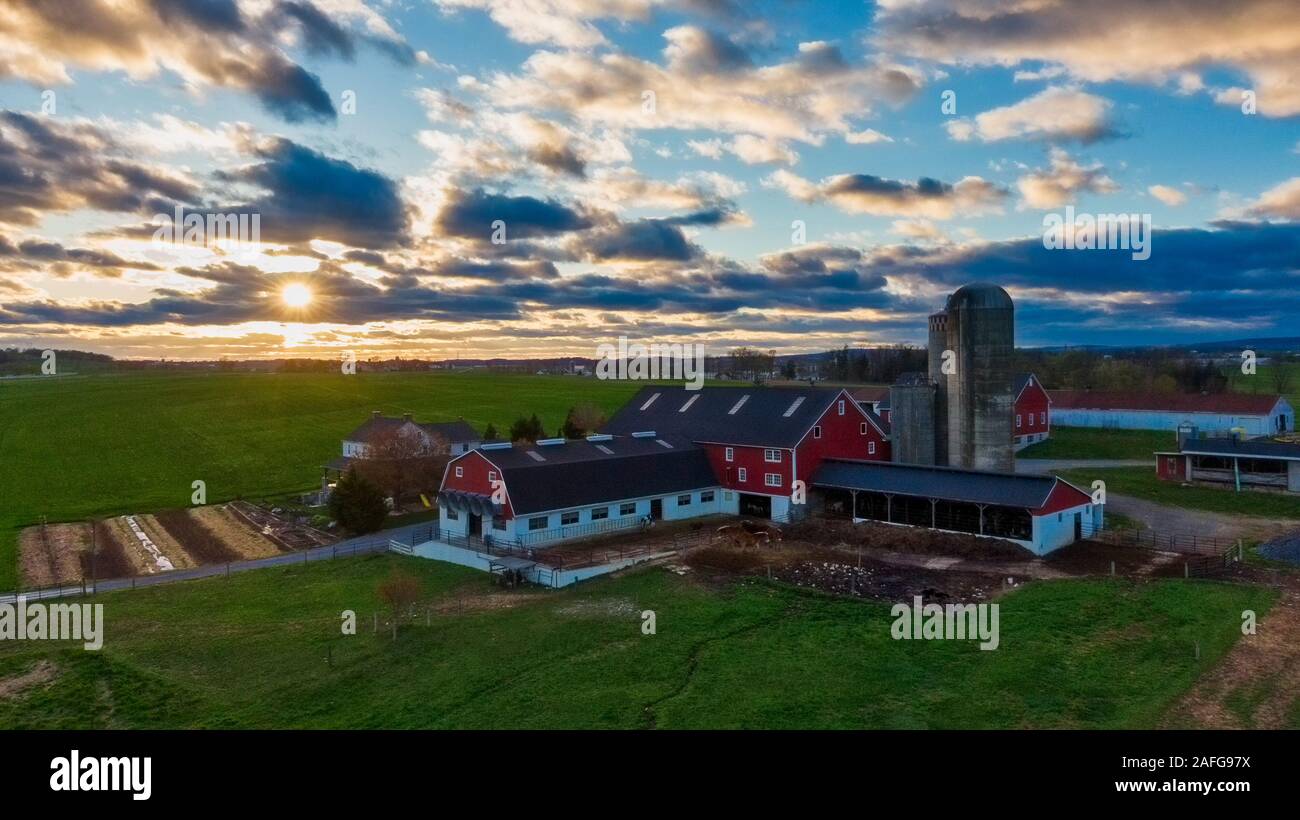 Traditional vintage american farm in dramatic sunset, wooden house and ...