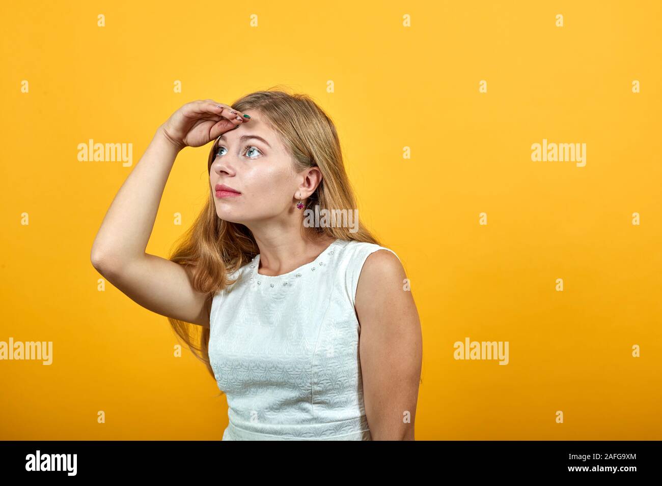 Attractive blonde girl looking distance hi-res stock photography and ...