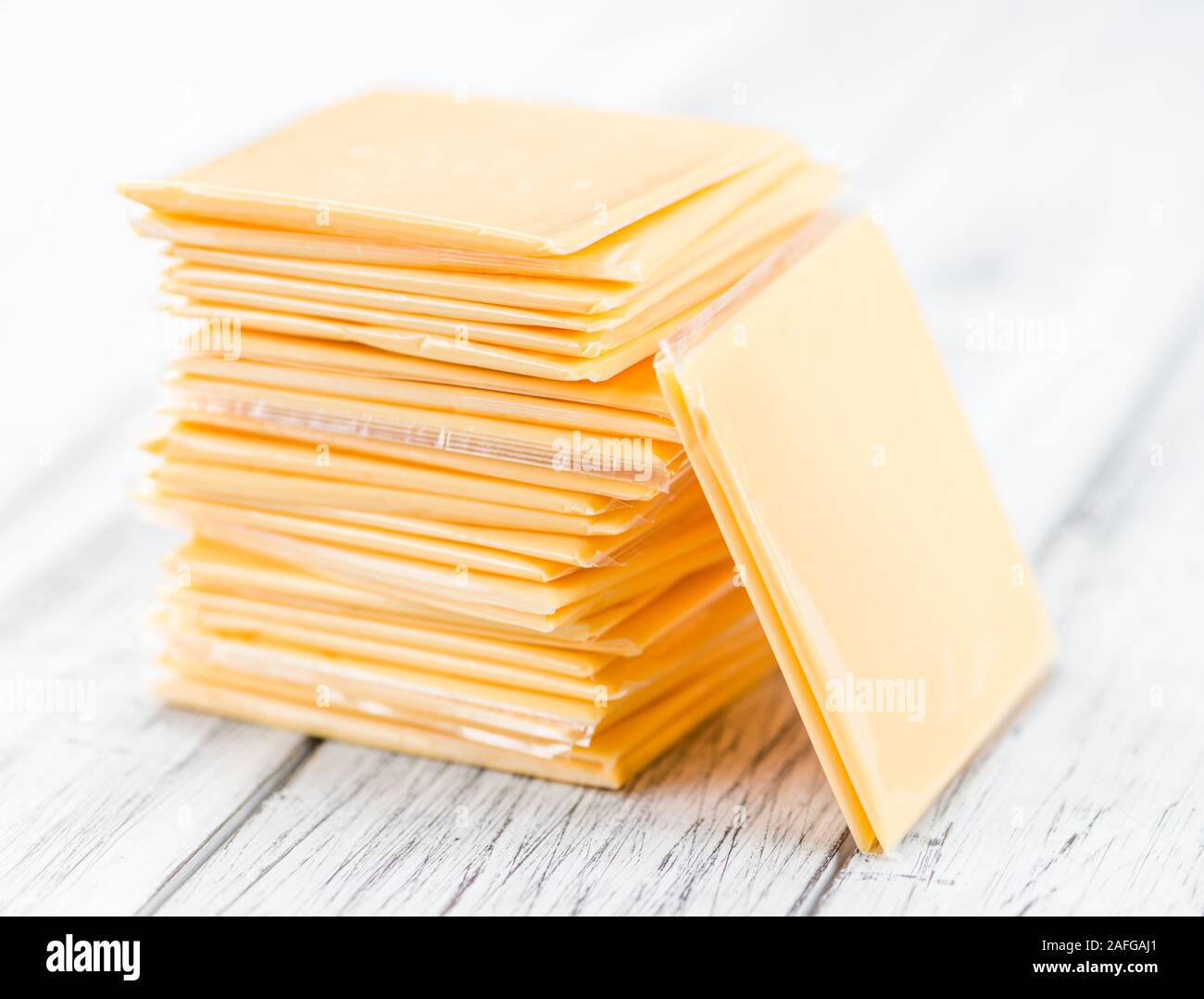 Sliced Cheese on a vintage background as detailed close-up shot ...