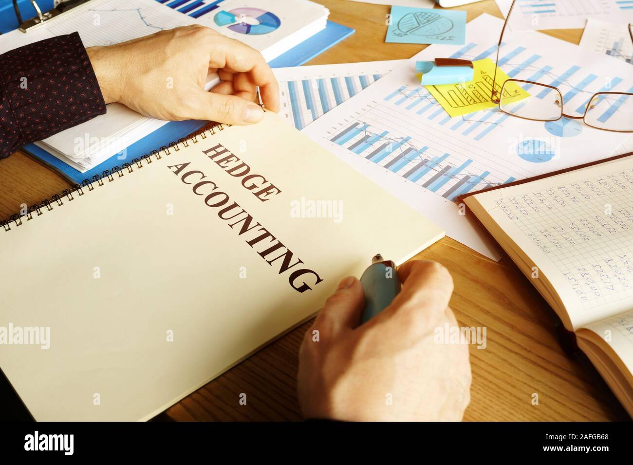 Hedge accounting report and financial papers on the desk Stock Photo ...
