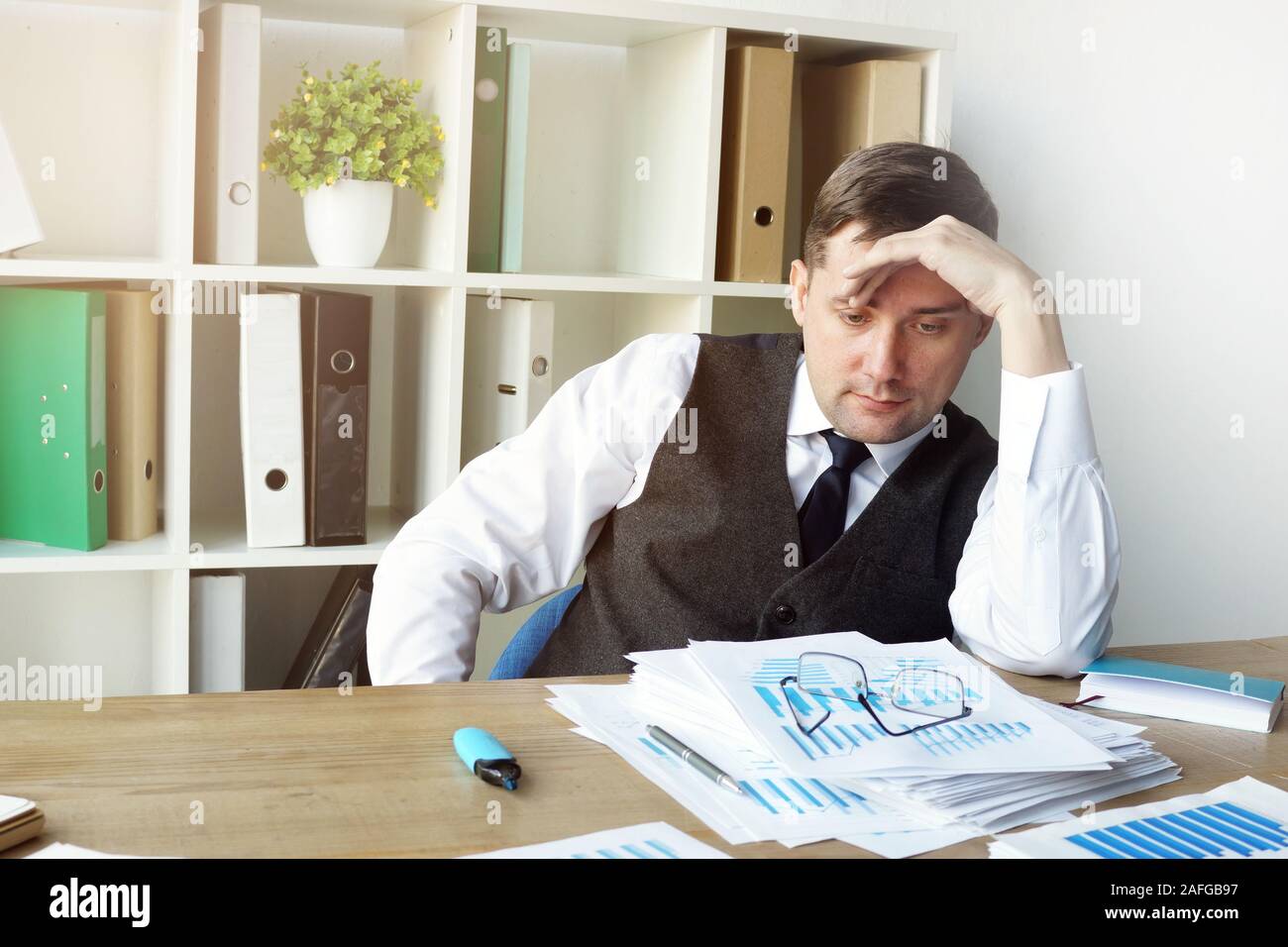 Exhausted accountant with accounting book and financial report Stock ...