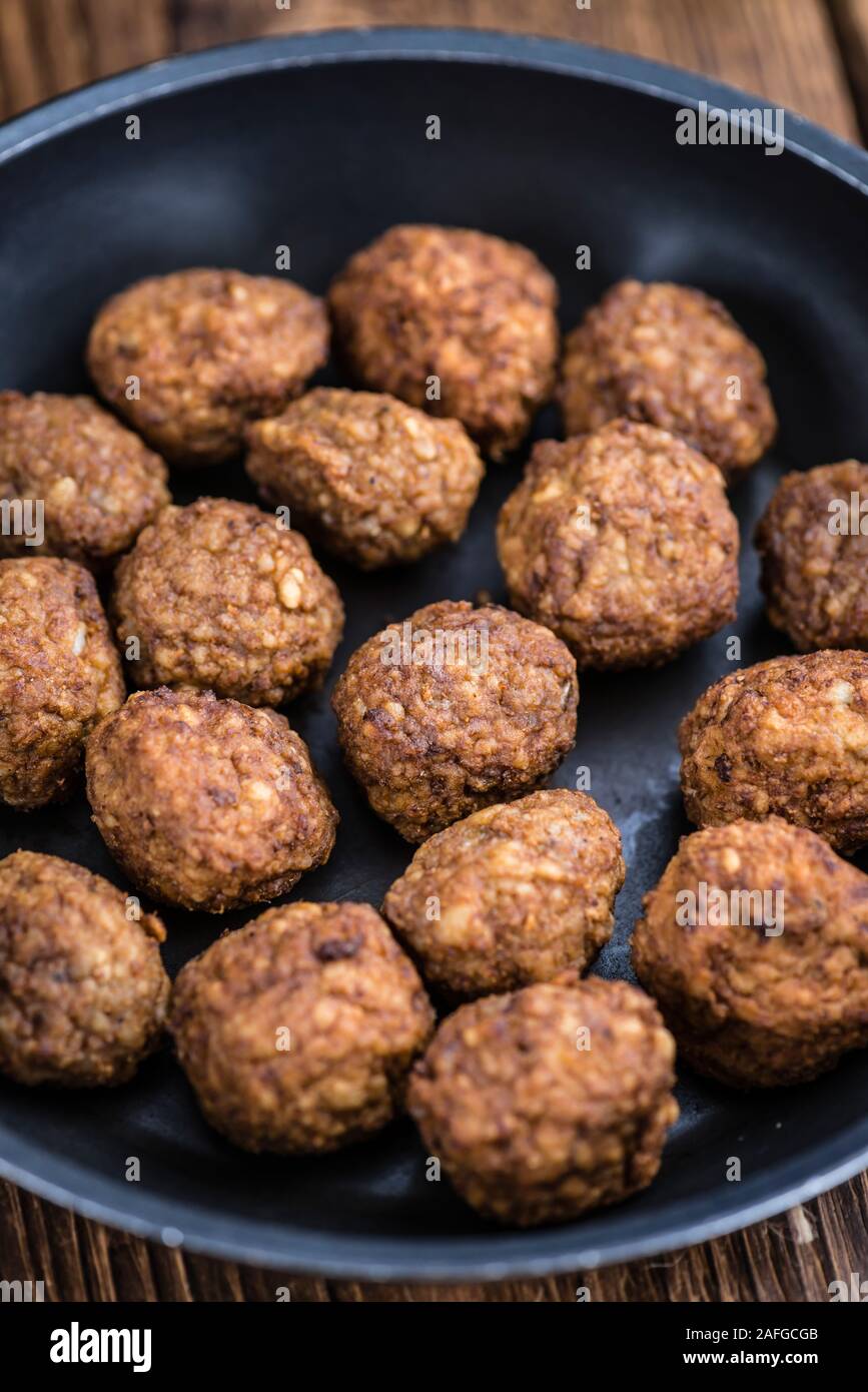 Fresh made Meatballs (close-up shot) on wooden background (selective ...