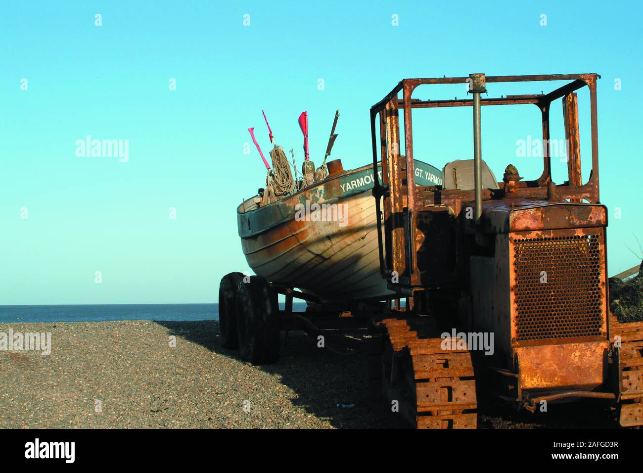 Fishing boat and tractor Stock Photo - Alamy
