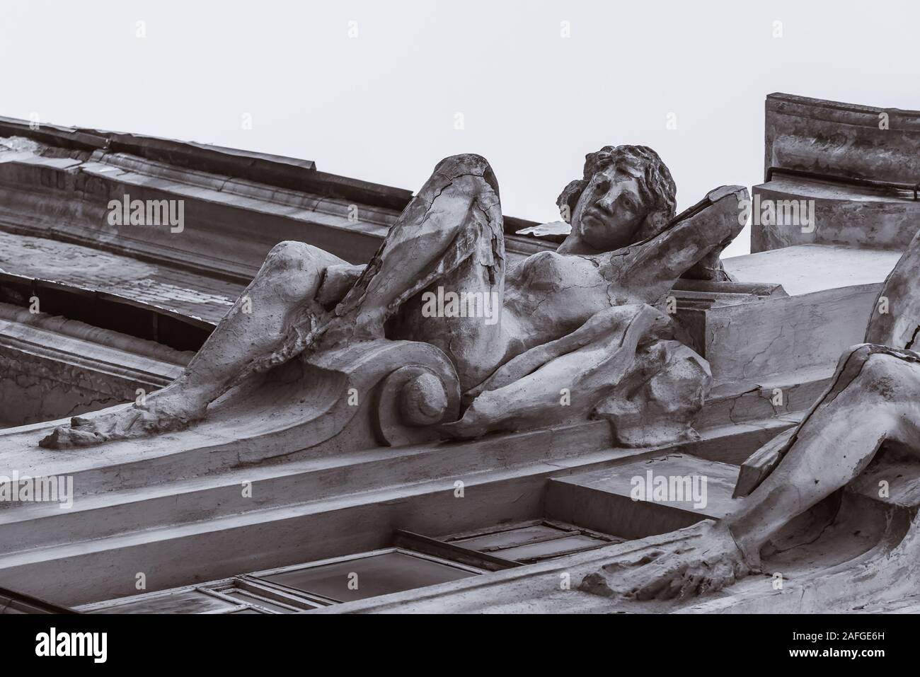 two statues adorn the facade of an old house Stock Photo - Alamy