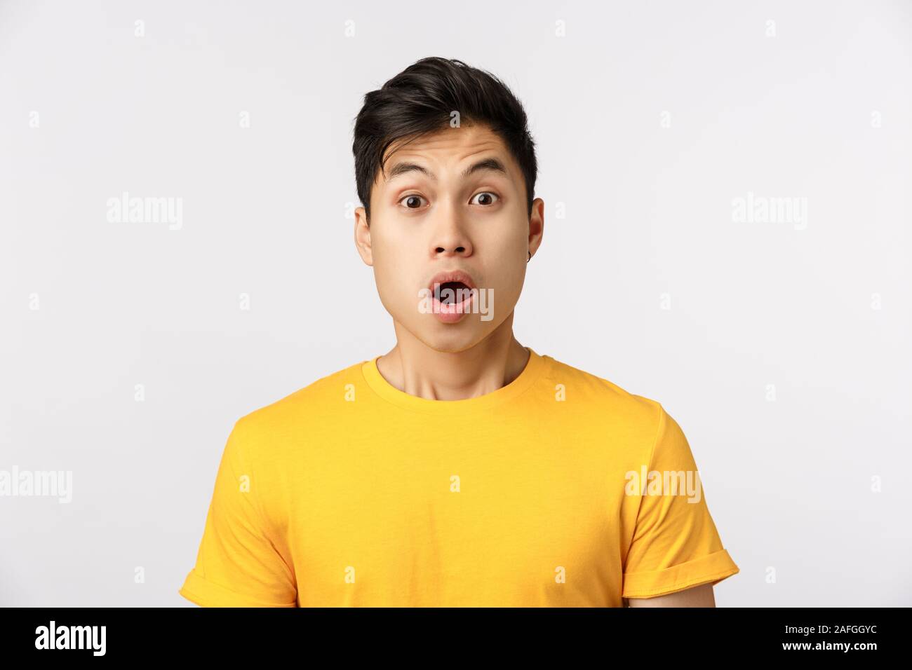 Close-up shot amazed, impressed or surprised asian man, caught ...