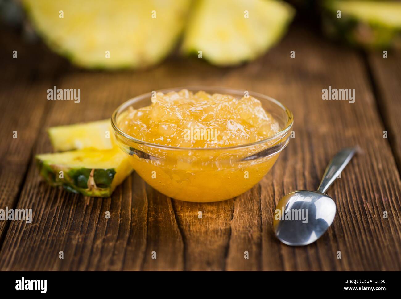 Fresh made Pineapple Jam on a vintage background as detailed close-up ...