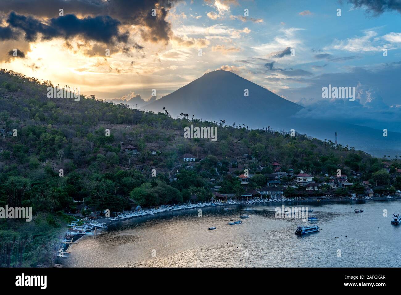 Colorful sunset with Mount Agung and Amed beach in Bali, Indonesia ...