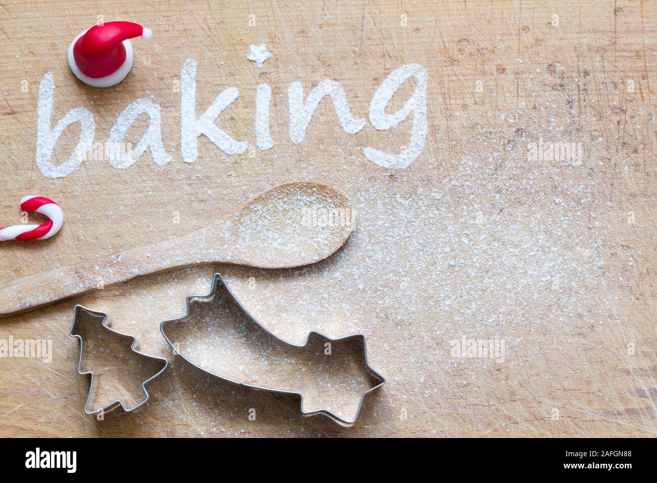Christmas background with cookies molds, spoon and sweet decoration ...
