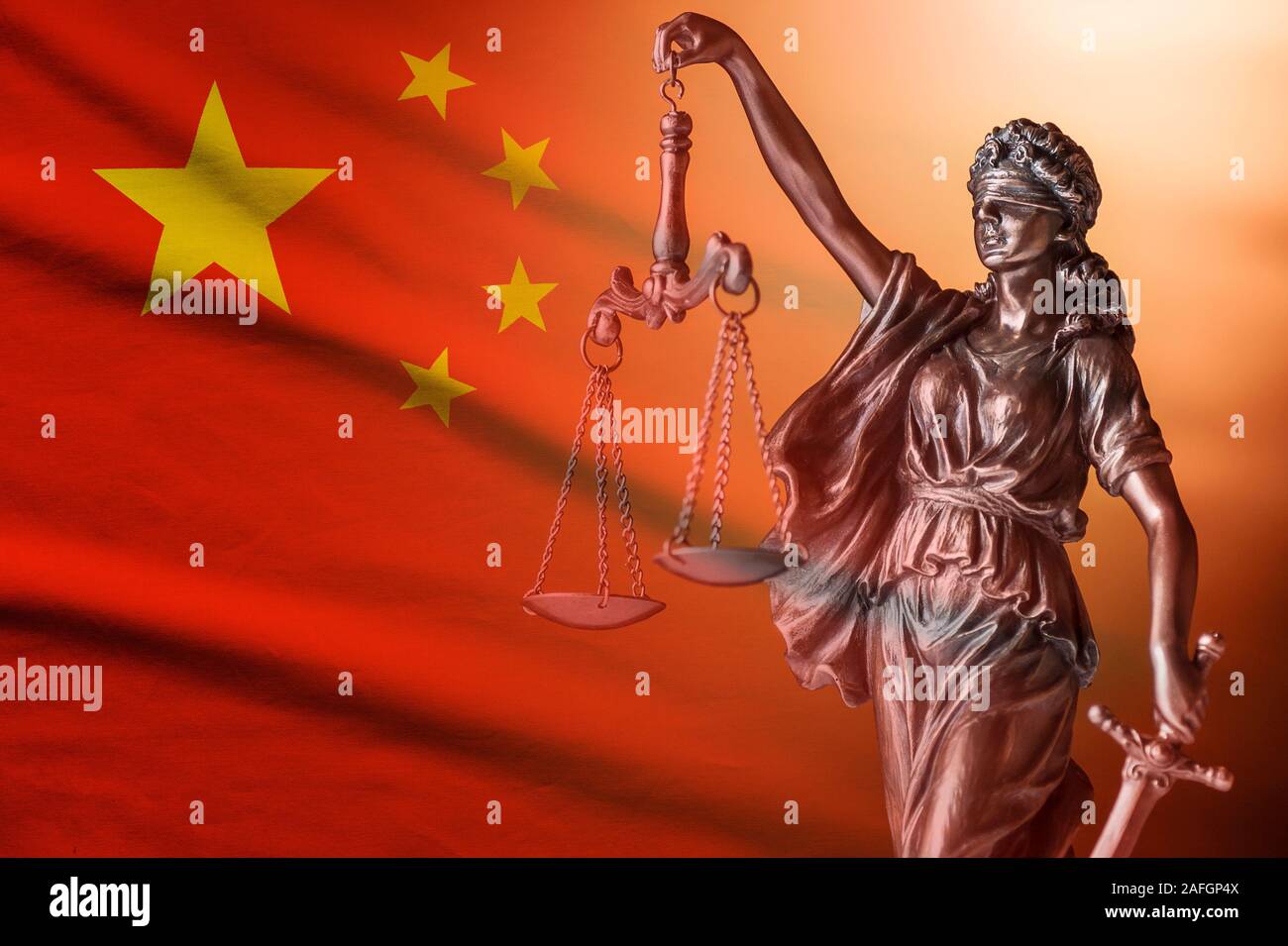 Figure of Justice with the national flag of China Stock Photo - Alamy