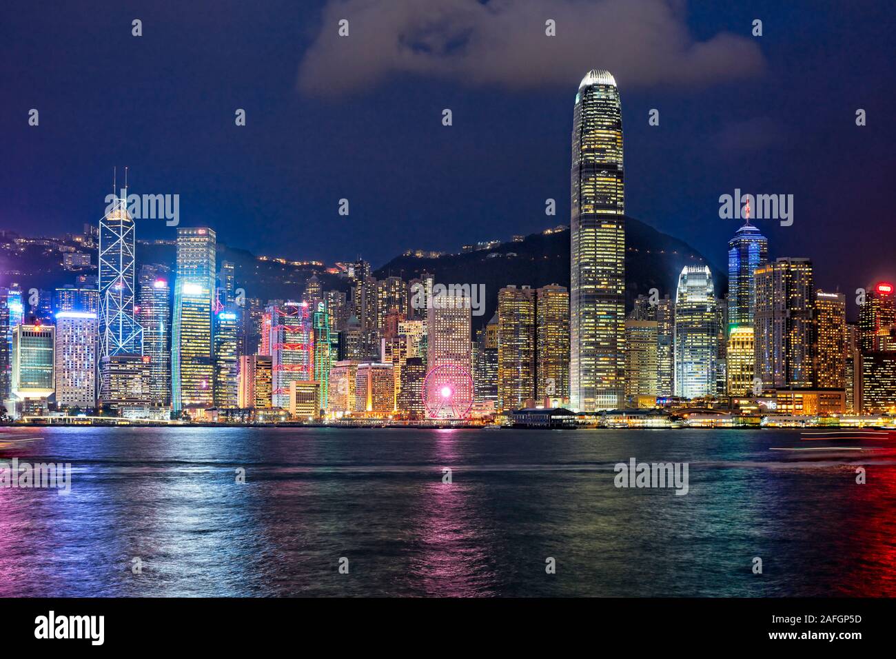 Central Waterfront buildings illuminated at night. Hong Kong, China ...