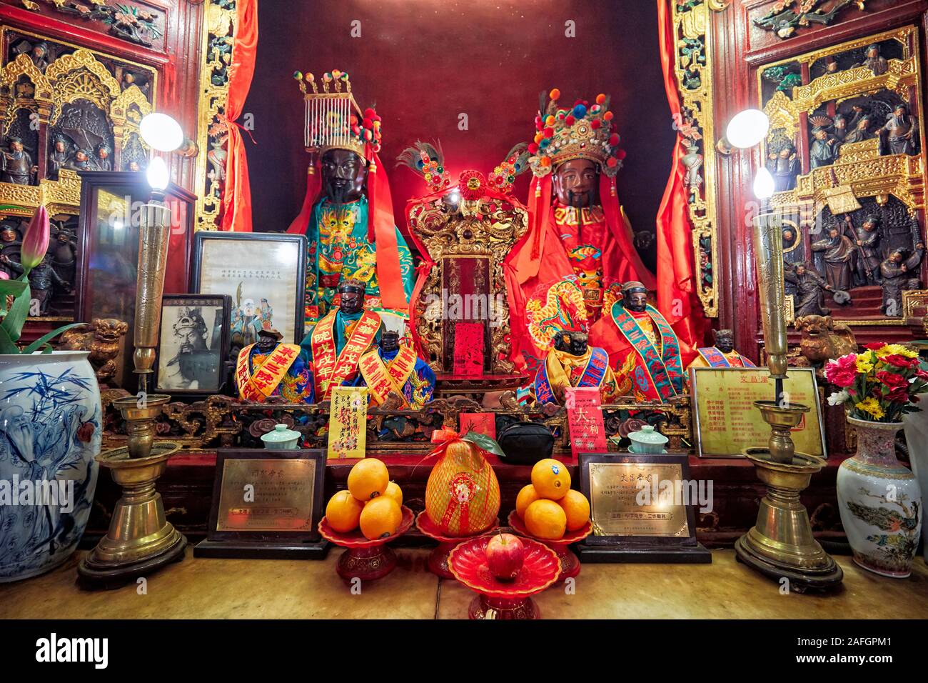 Altar with offerings in Man Mo Temple dedicated to the civil god Man ...