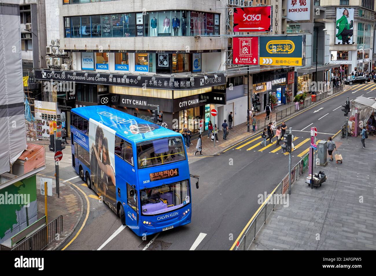 Blue double-decker bus turning on Queen's Road Central. Central, Hong ...