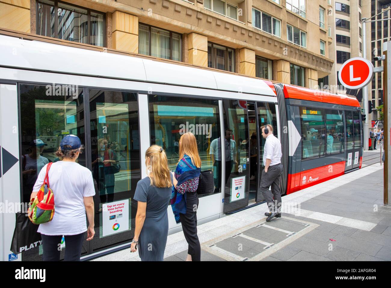 Sydney light rail tram, passengers wait for the light rail train on its ...